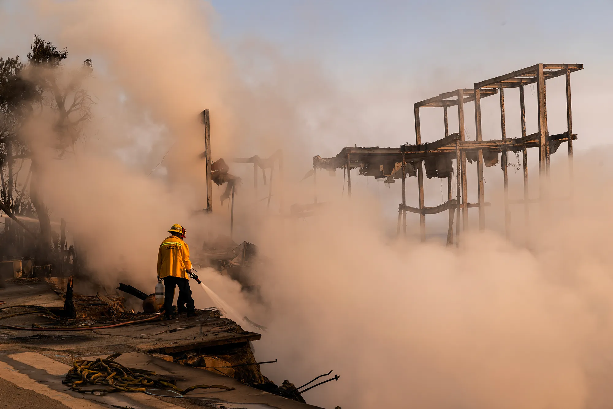 Slight reprieve from Santa Ana winds aids efforts to contain L.A. fires ...